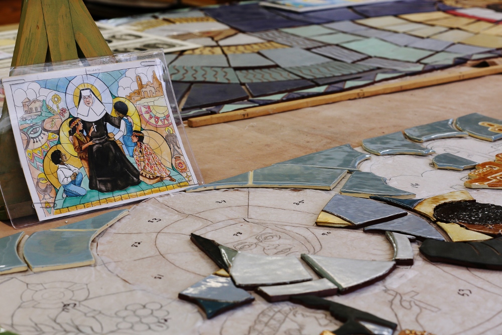 Muralist says inspiration of Holy Spirit drives her creativity, artwork ...